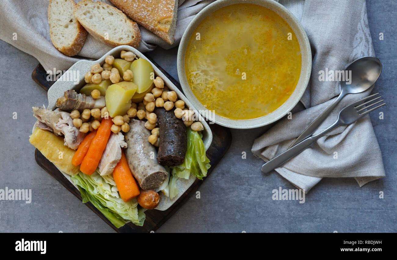 Cocido, traditional chickpea-based stew from Madrid. on the grey stone ...