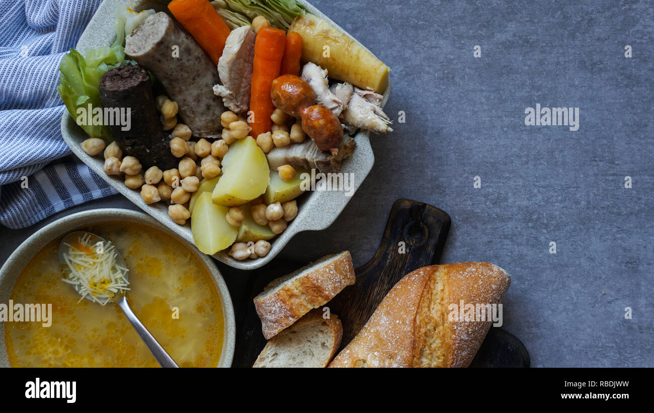 Cocido, traditional chickpea-based stew from Madrid. on the grey stone ...