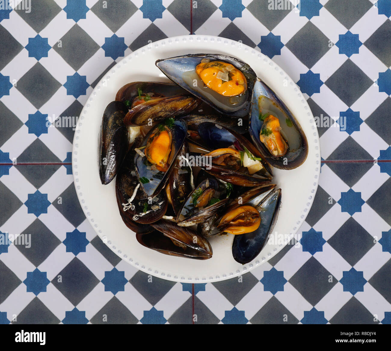 Traditional spanish seafood mussels on the mediterranean ceramic ...