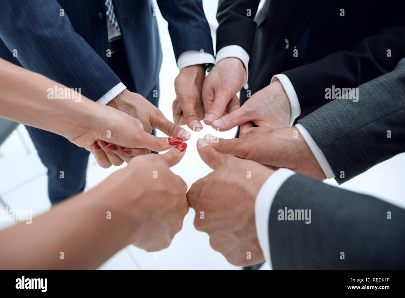 close up. business colleagues showing their unity Stock Photo - Alamy