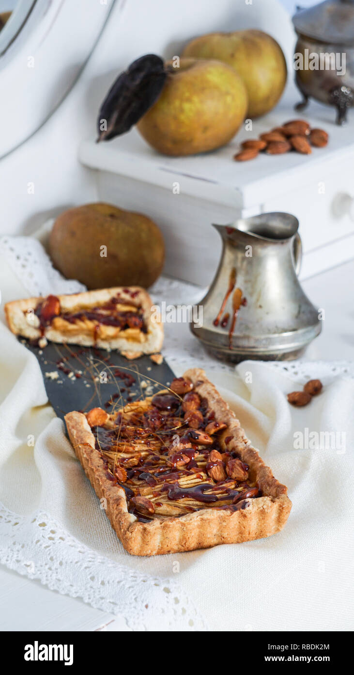 caramel apple tart on the white wooden buffet, grey rennet apples Stock ...