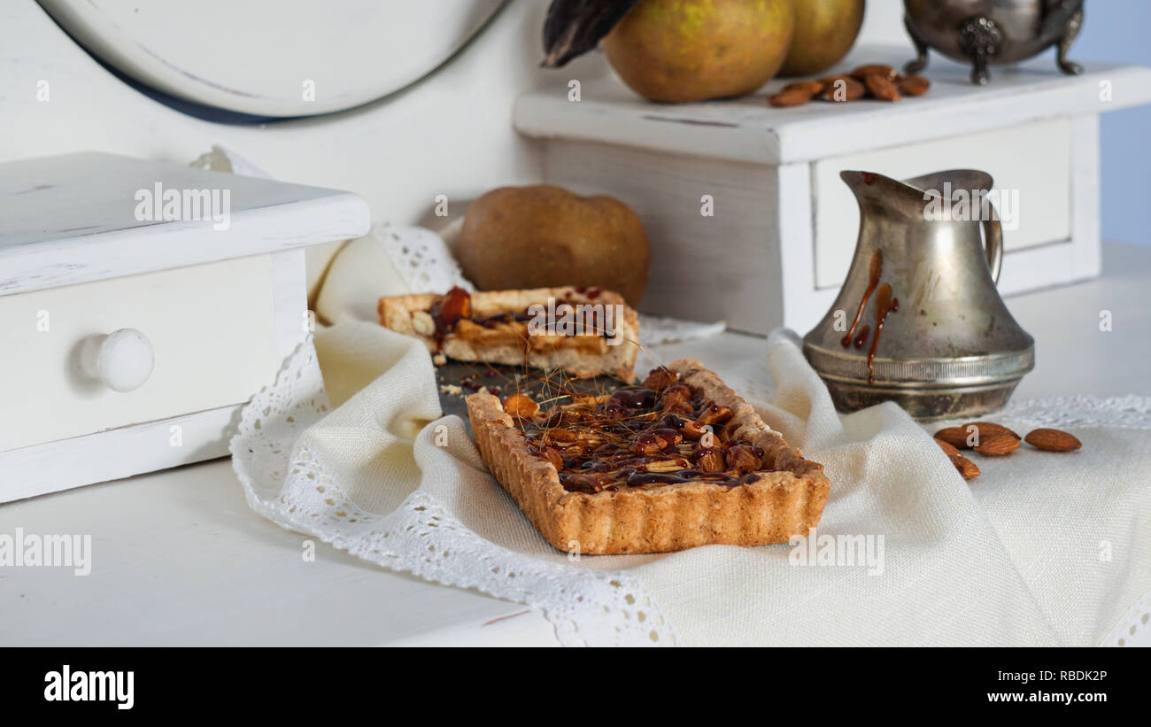 caramel apple tart on the white wooden buffet, grey rennet apples Stock ...