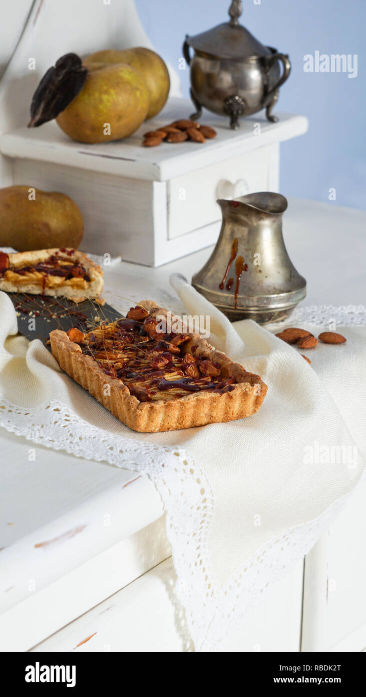 caramel apple tart on the white wooden buffet, grey rennet apples Stock ...