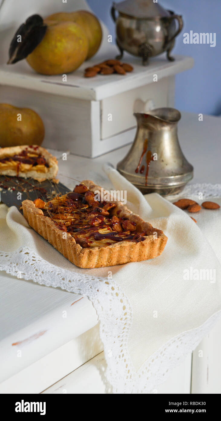 caramel apple tart on the white wooden buffet, grey rennet apples Stock ...