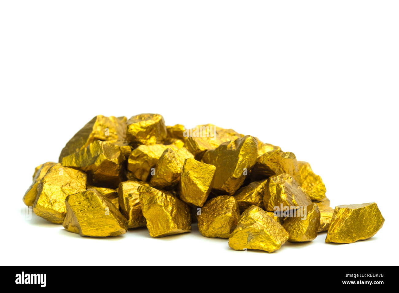 A pile of gold nuggets or gold ore on white background, precious stone ...