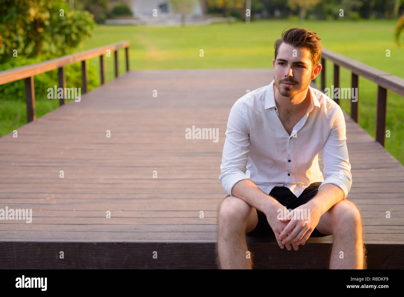 Guy sitting and thinking hi-res stock photography and images - Alamy