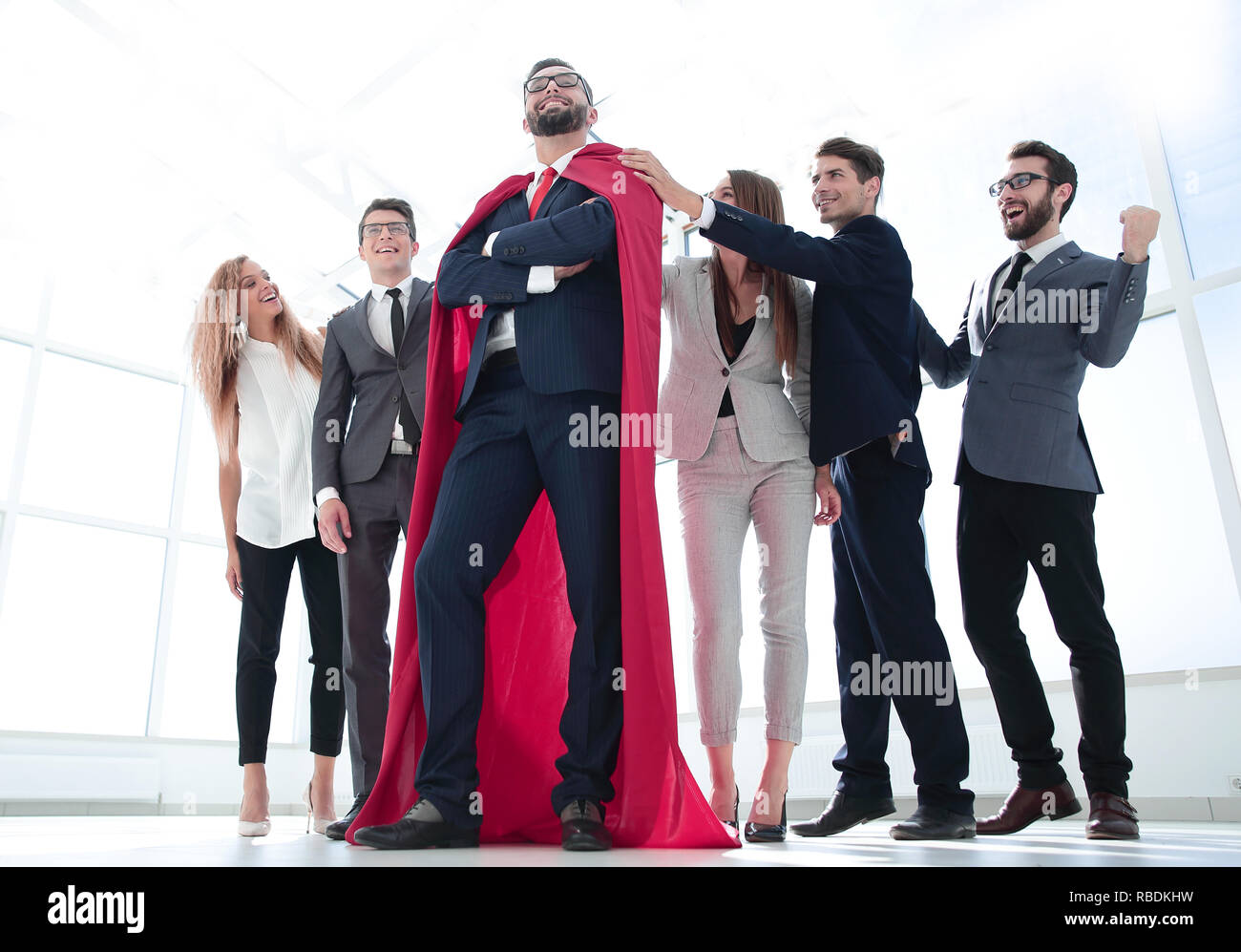 boss is a superhero and the business team is standing together Stock ...