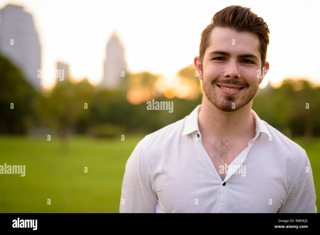 Attractive man smiling hi-res stock photography and images - Alamy