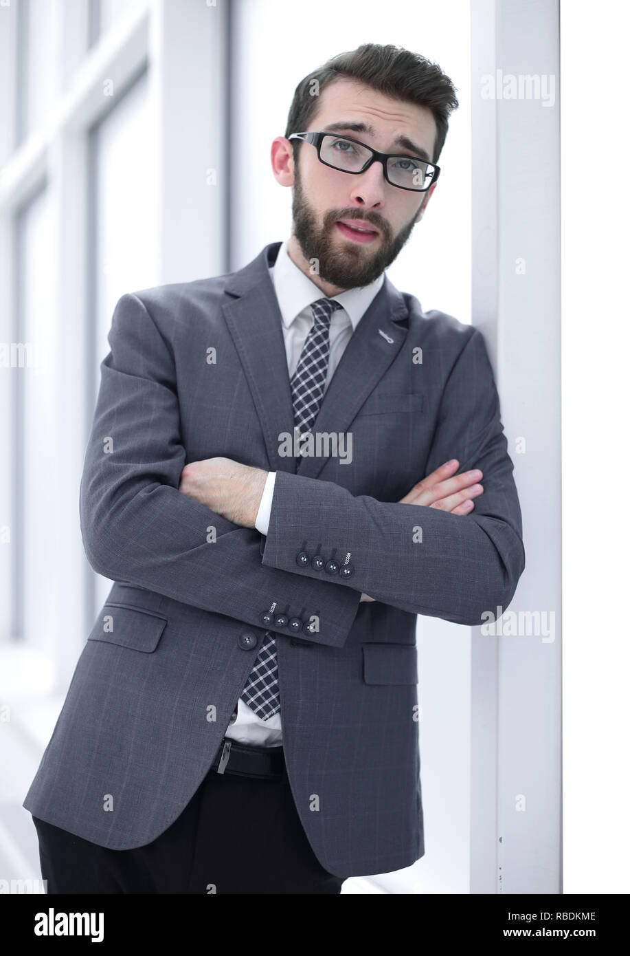 close up.smiling businessman standing in the office Stock Photo - Alamy