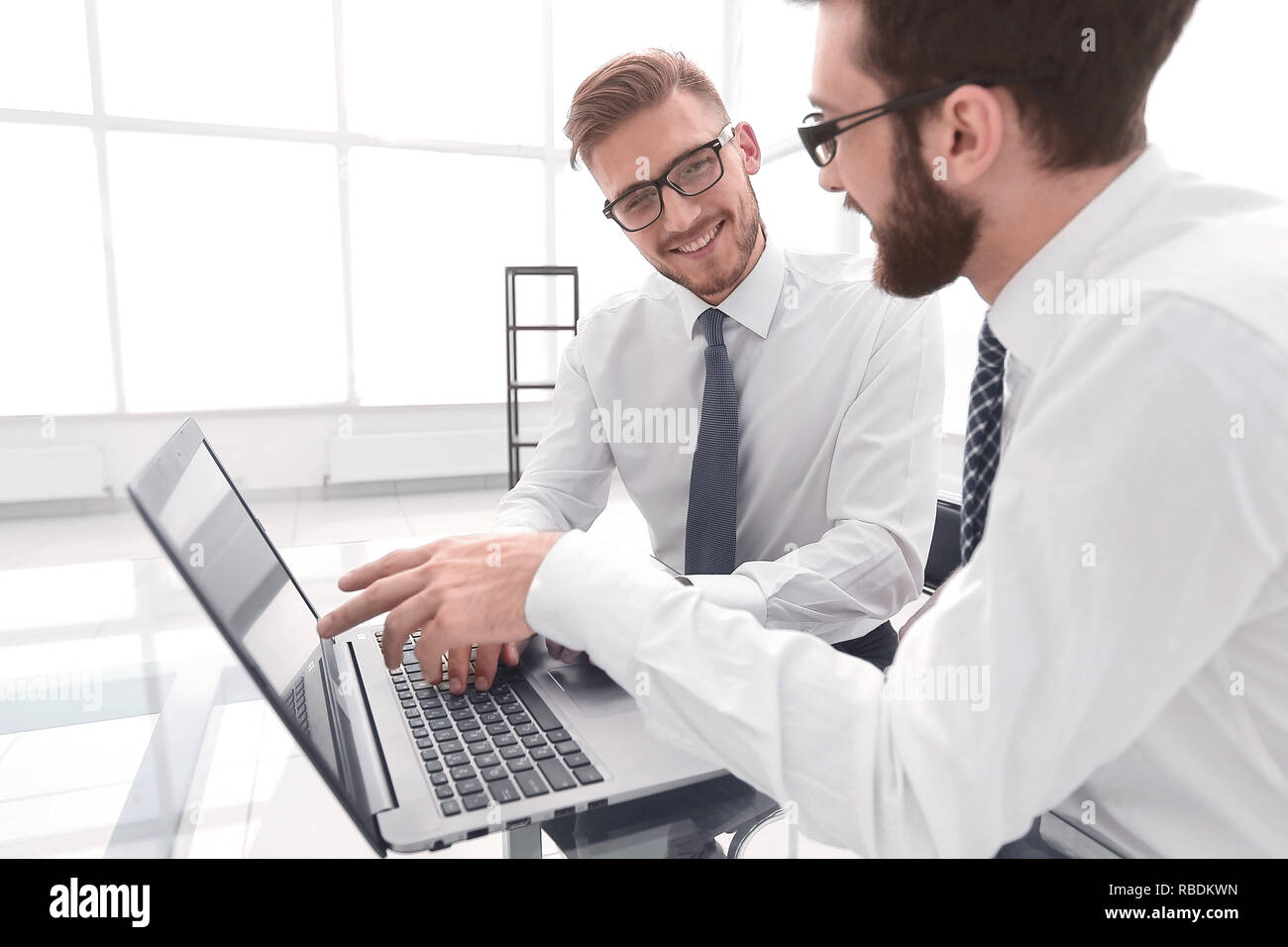 smiling employees at the Desk in the office Stock Photo - Alamy