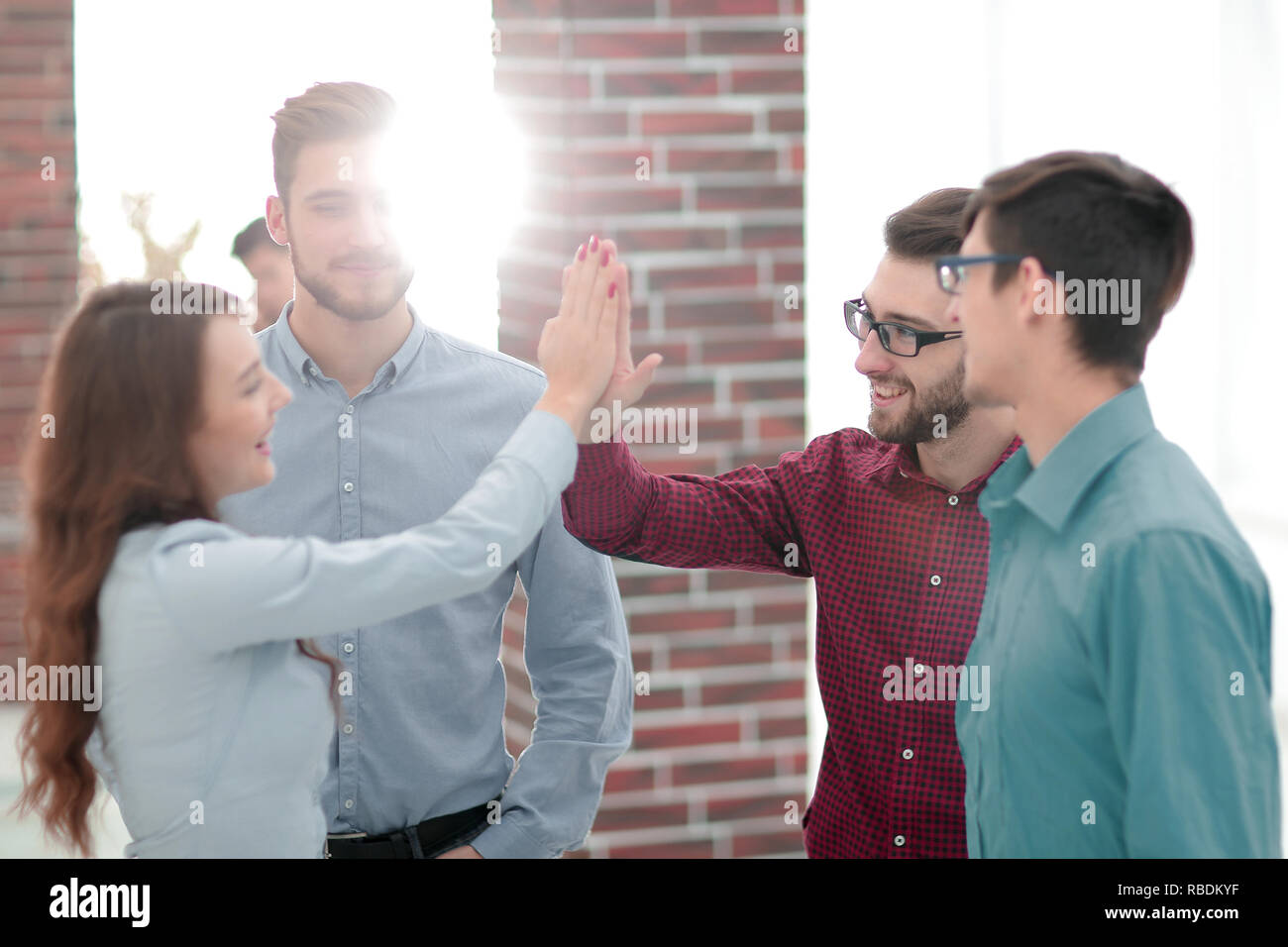 happy creative business people giving high-five in meeting room Stock ...