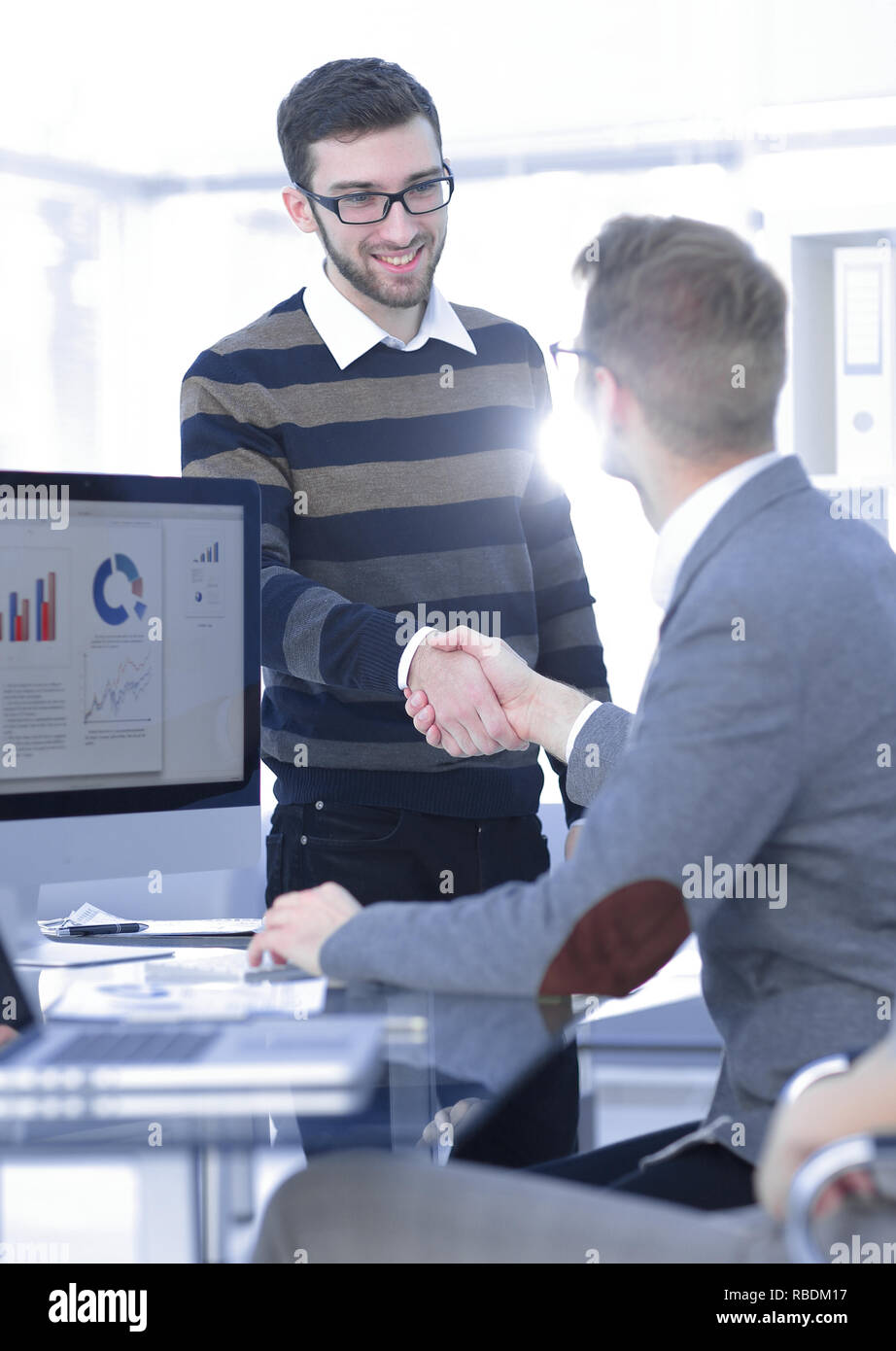 handshake Manager and the client Stock Photo - Alamy