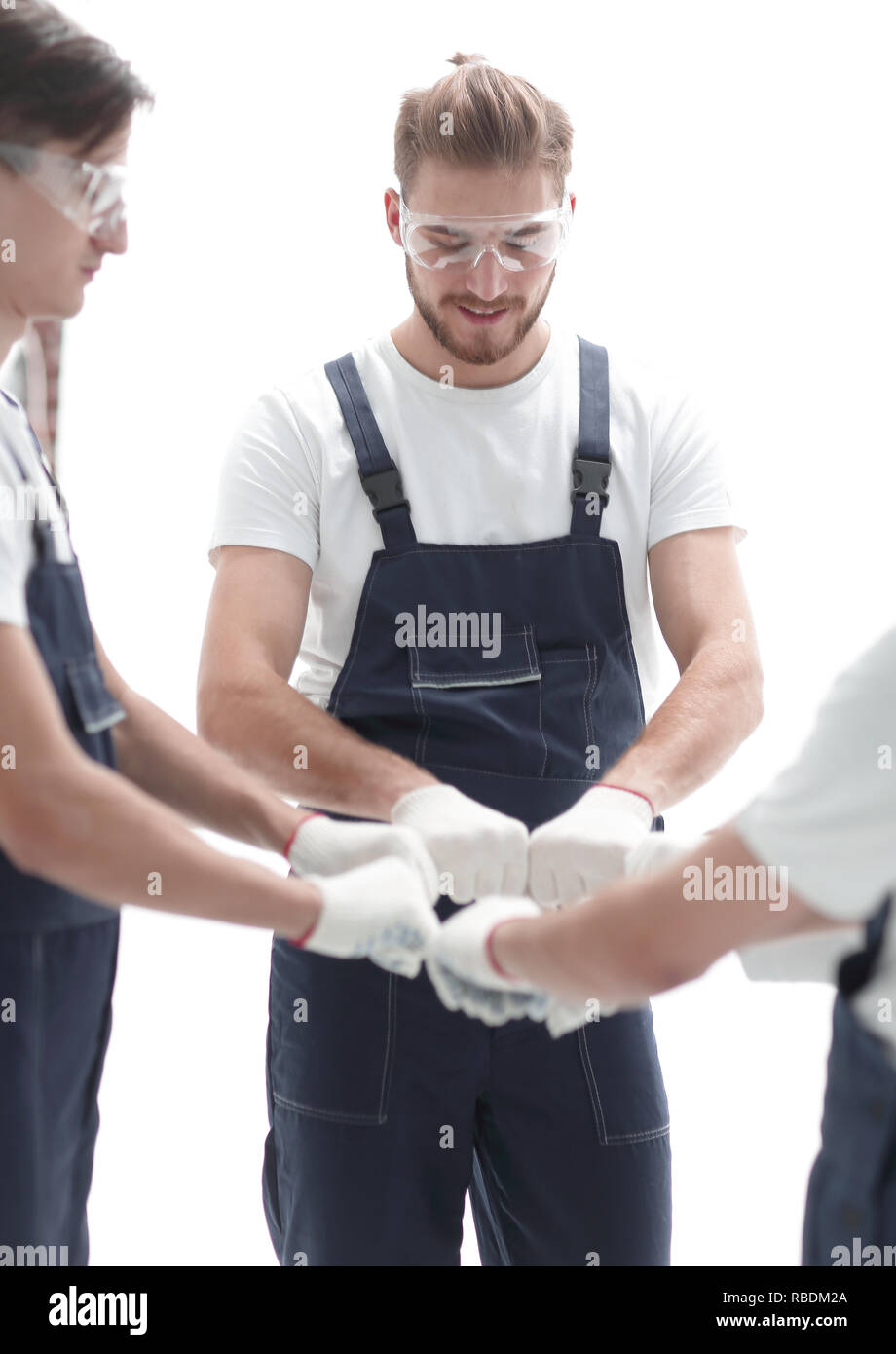closeup.Large group of workers standing in circle Stock Photo - Alamy