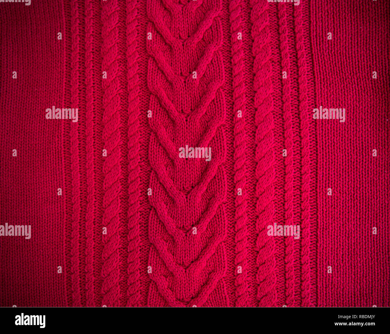 Red Knitted pattern wool sweater texture close up. Handmade red ...