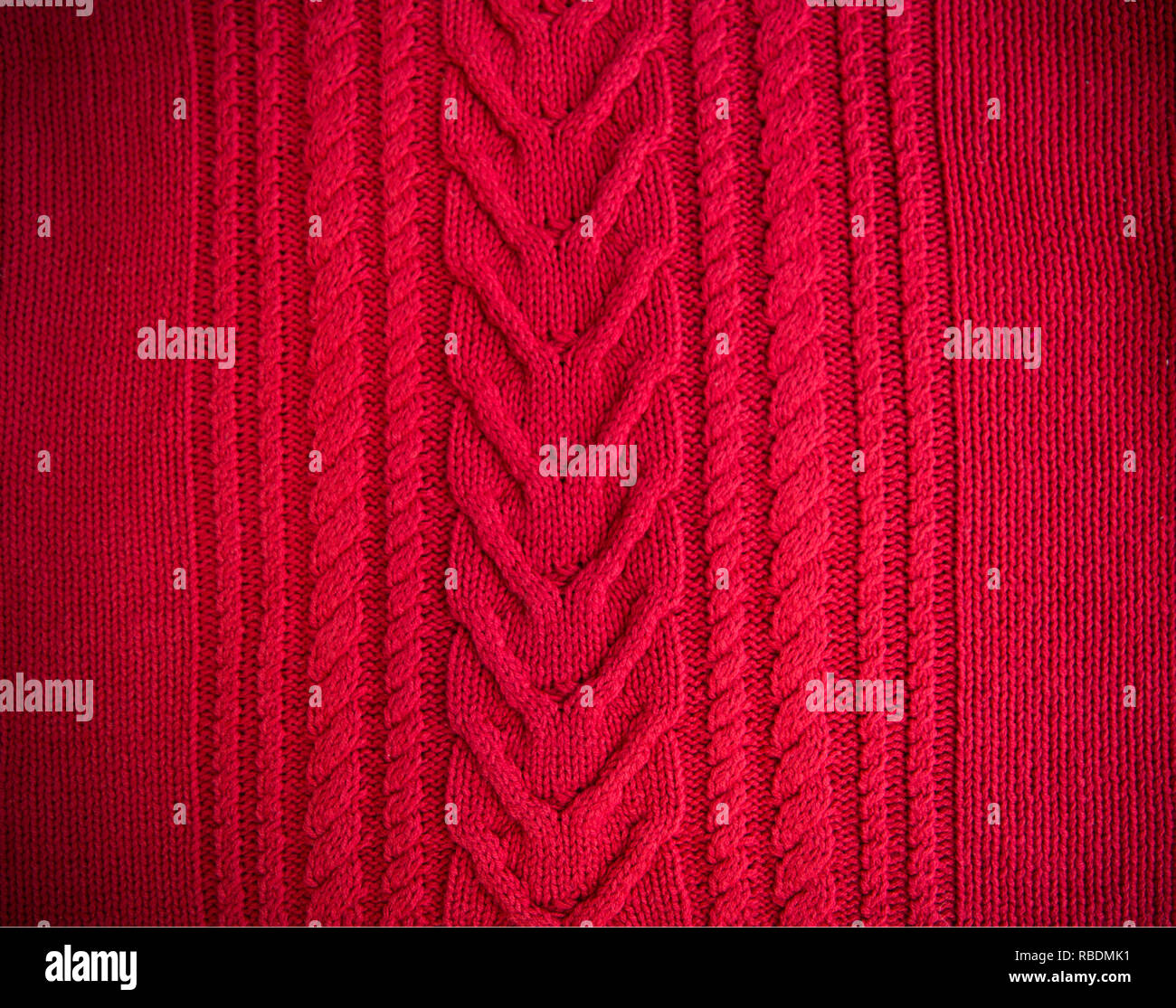 Red Knitted pattern wool sweater texture close up. Handmade red ...