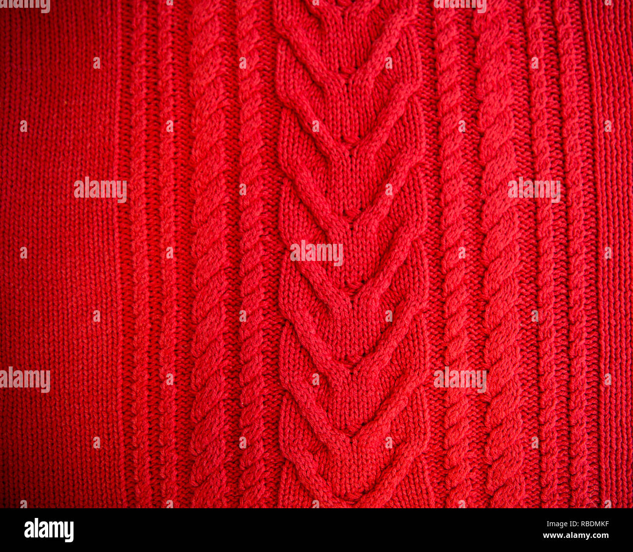 Red Knitted pattern wool sweater texture close up. Handmade red ...