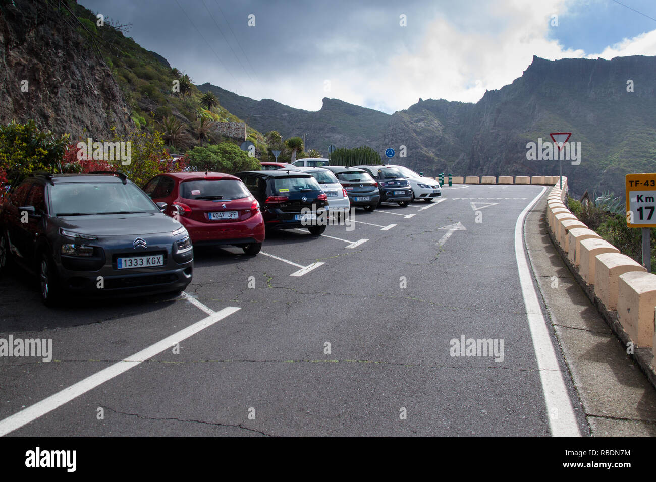Cars parking at a parking lot up high in the mountains Stock Photo - Alamy