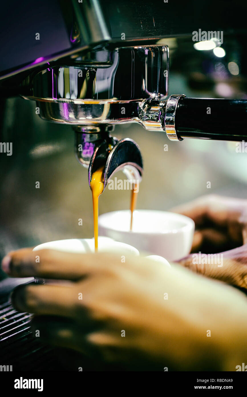 espresso shot from coffee machine in coffee shop, Coffee maker in ...