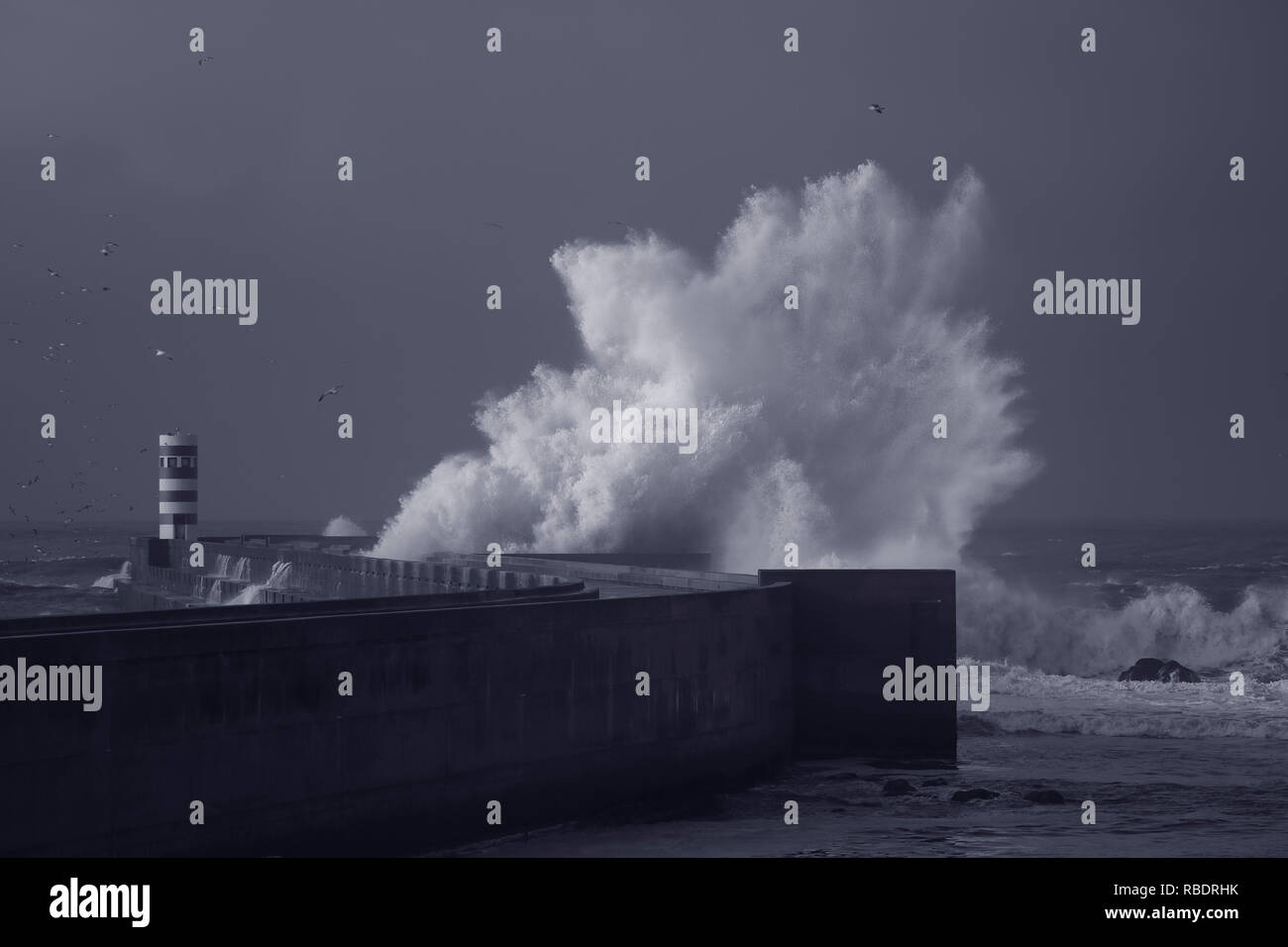 Big sea wave splash against rainy sky. Douro river mouth south pier and ...
