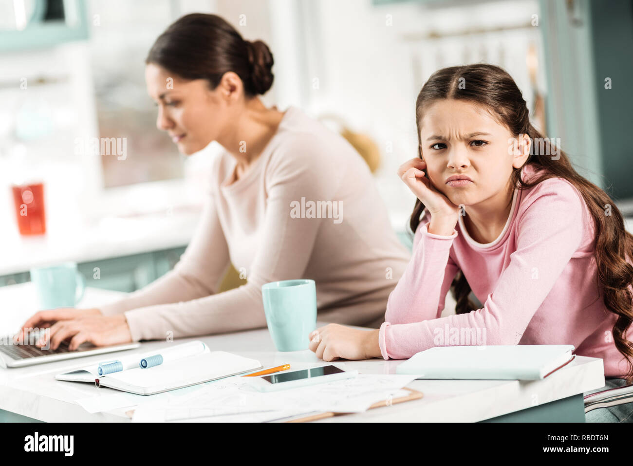 Do not bother me. Silhouette of young woman that staring at her laptop ...