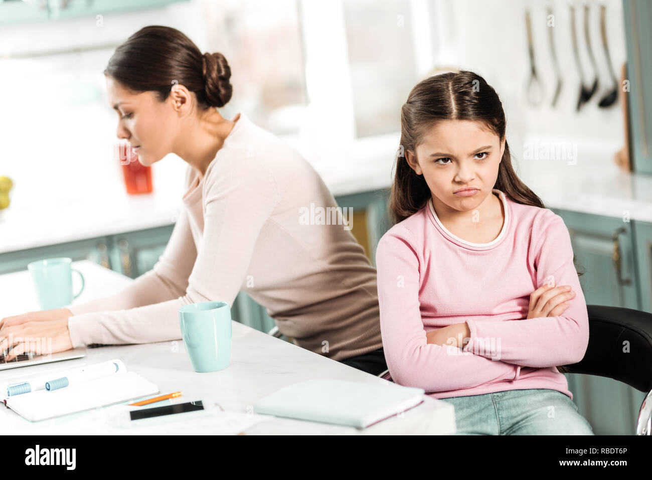 Need attention. Negative kid pressing lips while being bored Stock ...