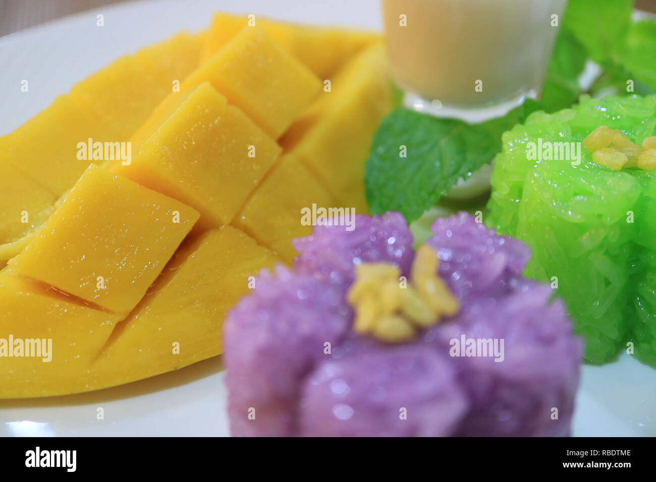 Closed Up Fresh Ripe Mango with Blurry Pea Flowers Sticky Rice in ...