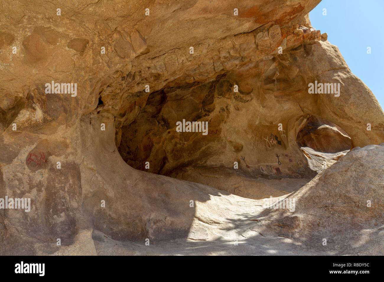 A small cave containing petroglyphs in the Barker Dam area of the ...