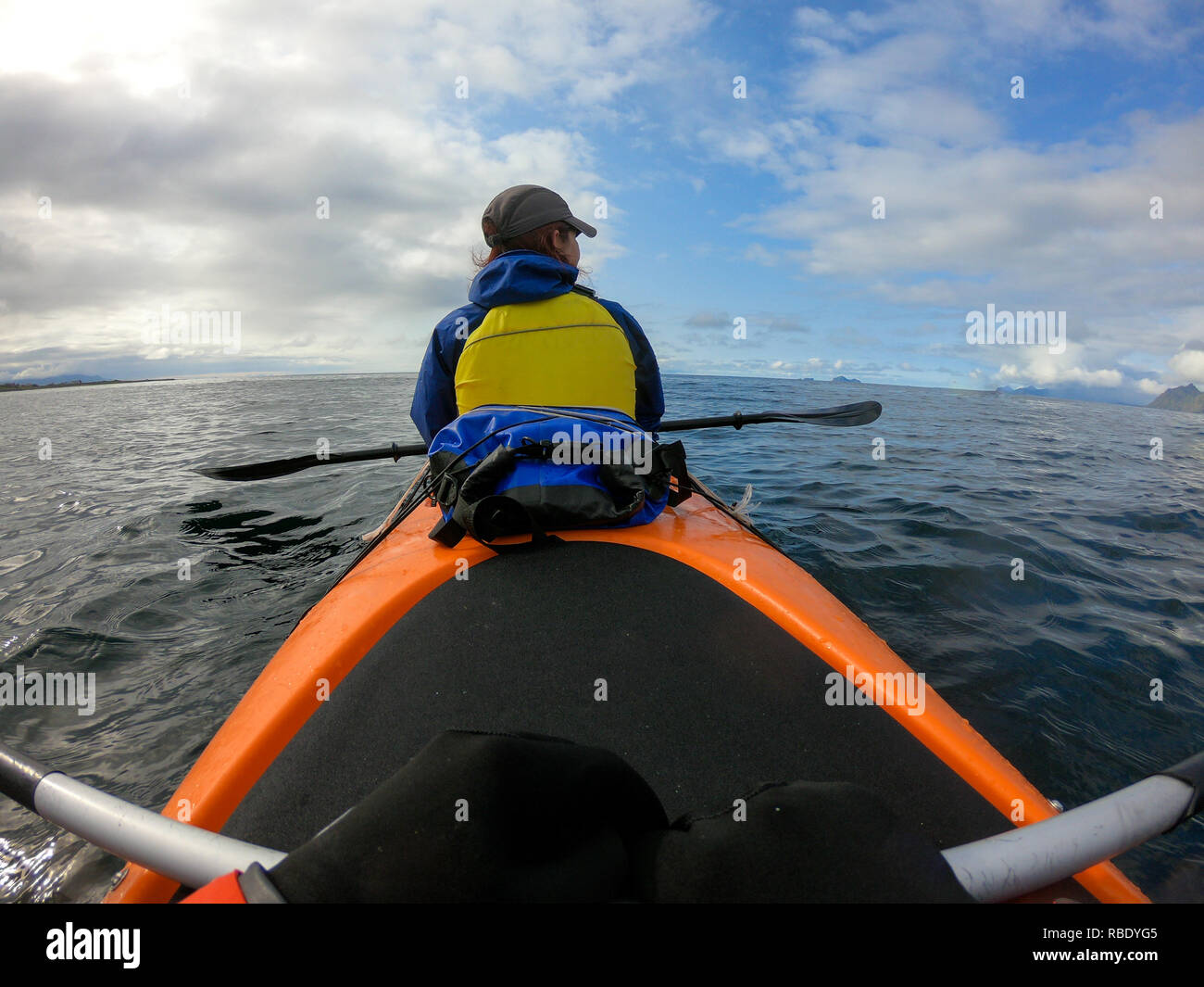 Image from back of female tourist with paddle on canoe floating Stock ...
