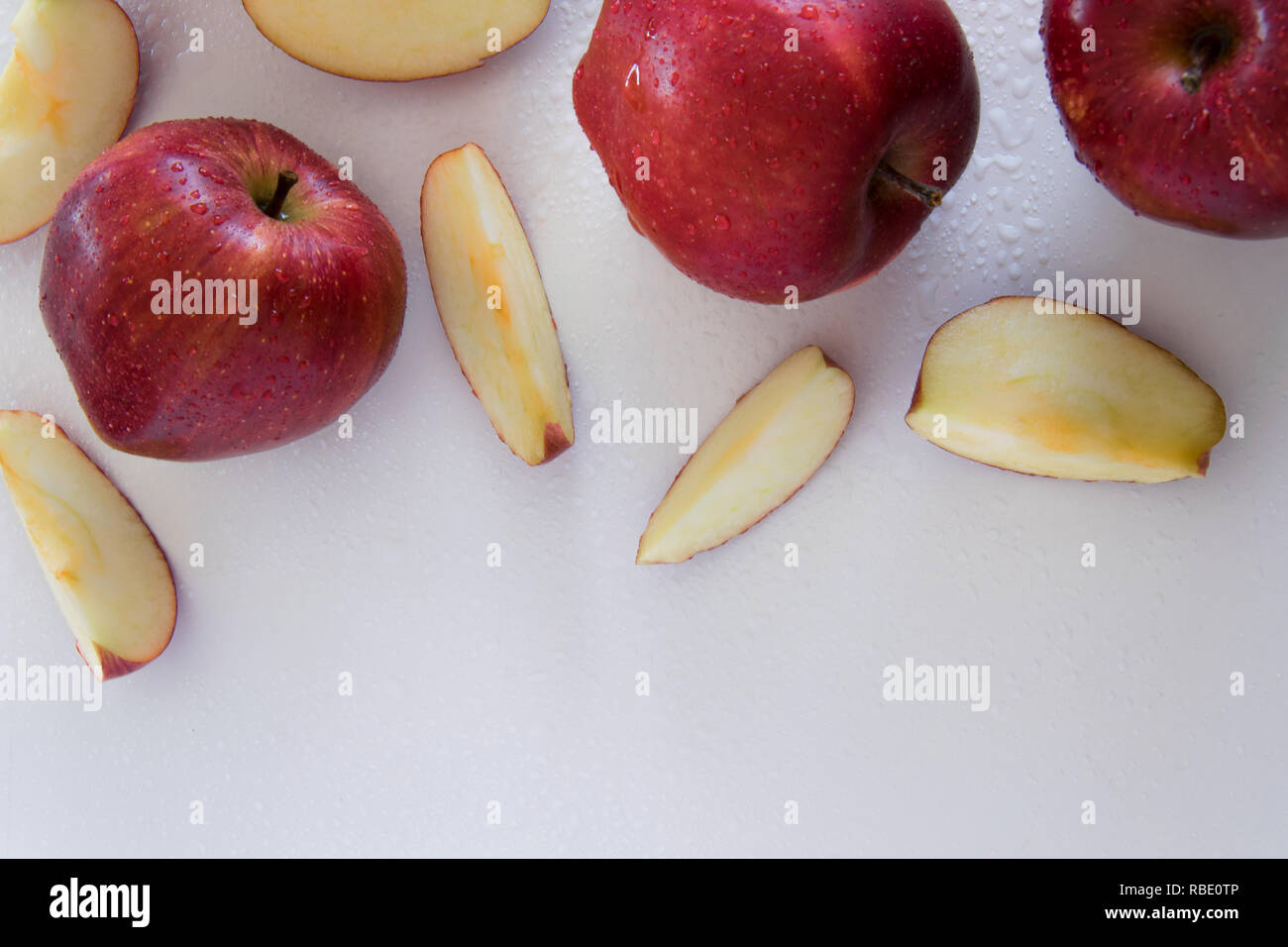 Top view of crispy red apples on white background, space for text ...