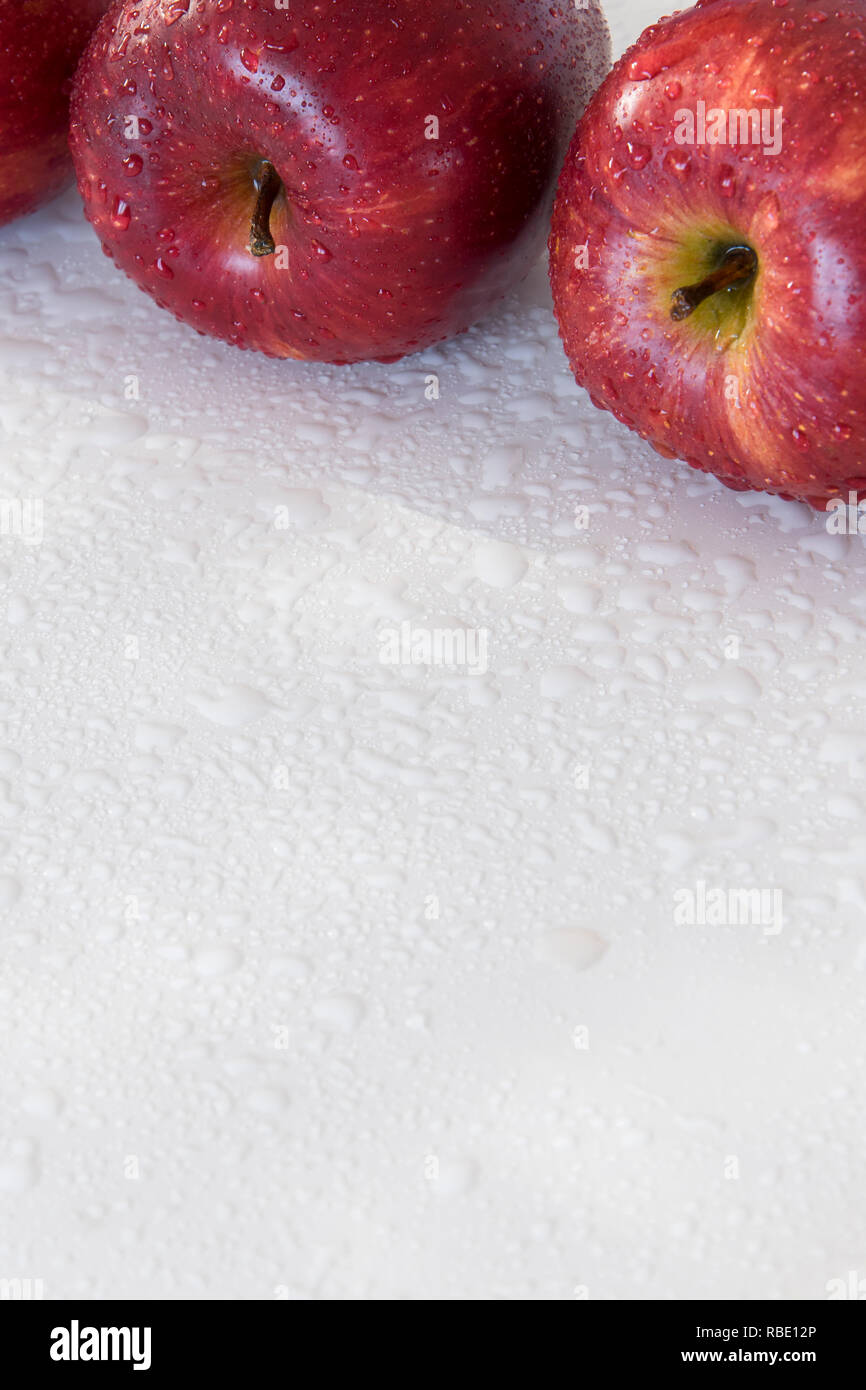 Three crispy red apples on white background, space for text. Healthy ...