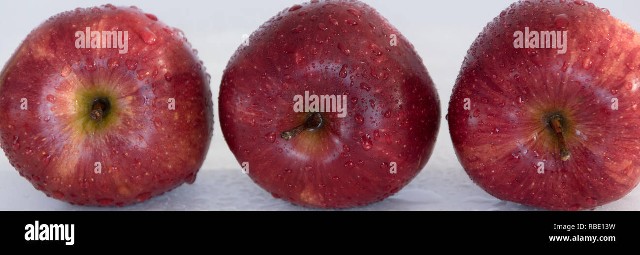Front view of three crispy red apples on white background. Healthy ...