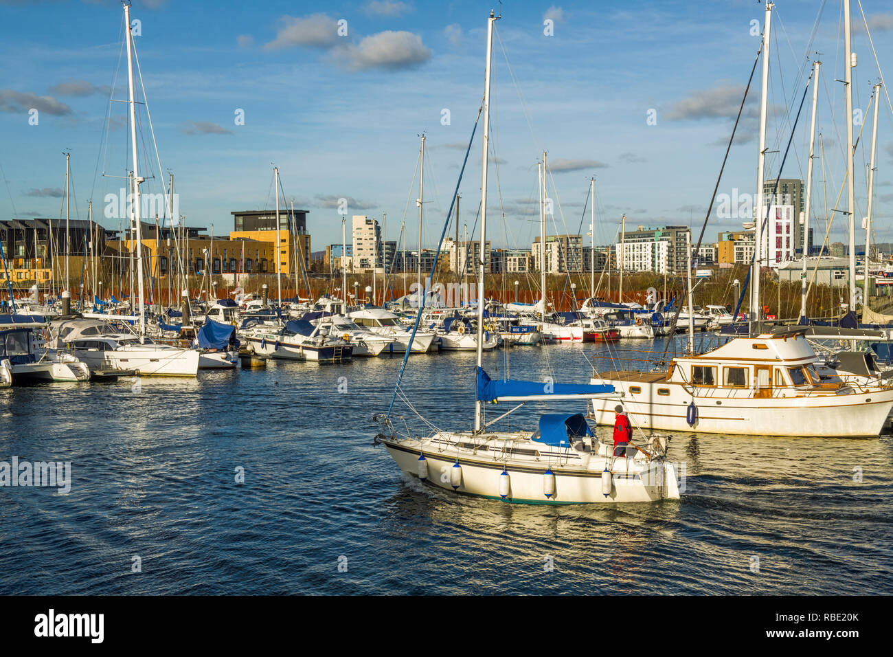 The River Ely coming into Cardiff Bay lined with apartments and full of ...