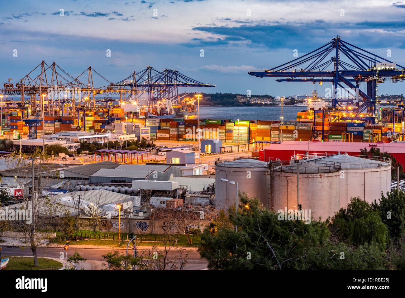 Trading Port Activity,trucks,vehicles, Hoisting Cranes at evening Stock ...