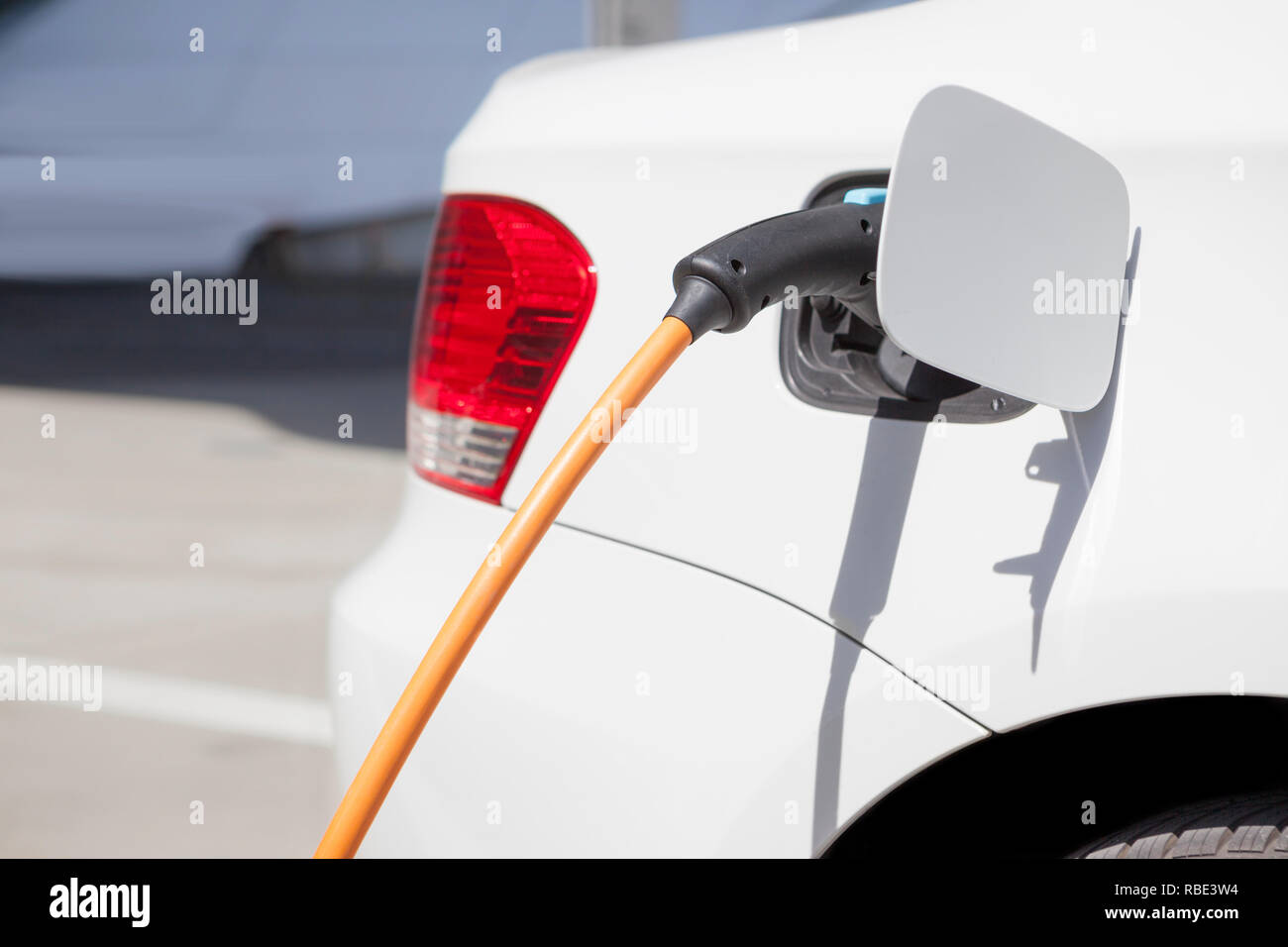 Detail view of an electric car being charged Stock Photo - Alamy