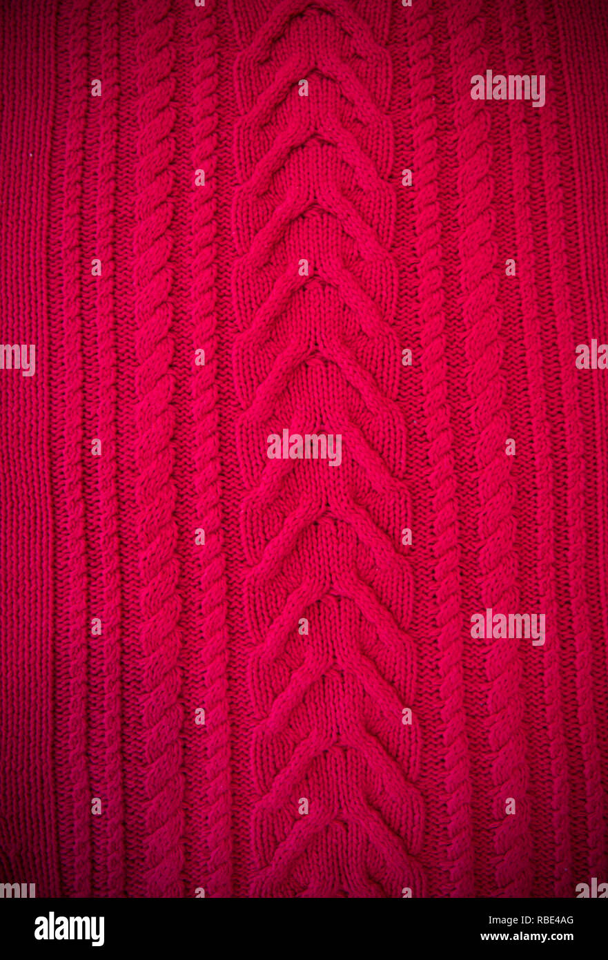 Red Knitted pattern wool sweater texture close up. Handmade red ...