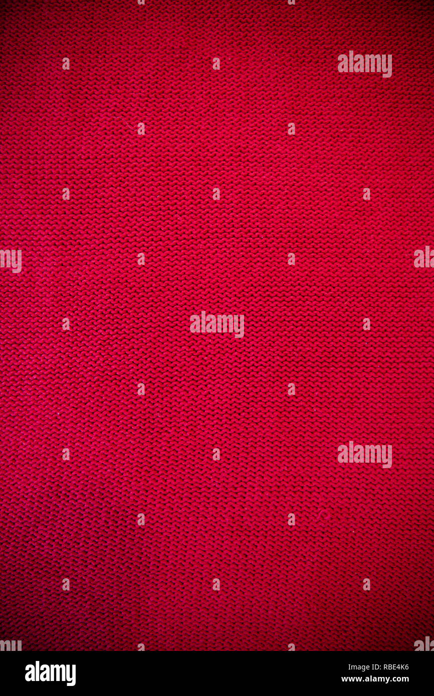 Red Knitted pattern wool sweater texture close up. Handmade red ...