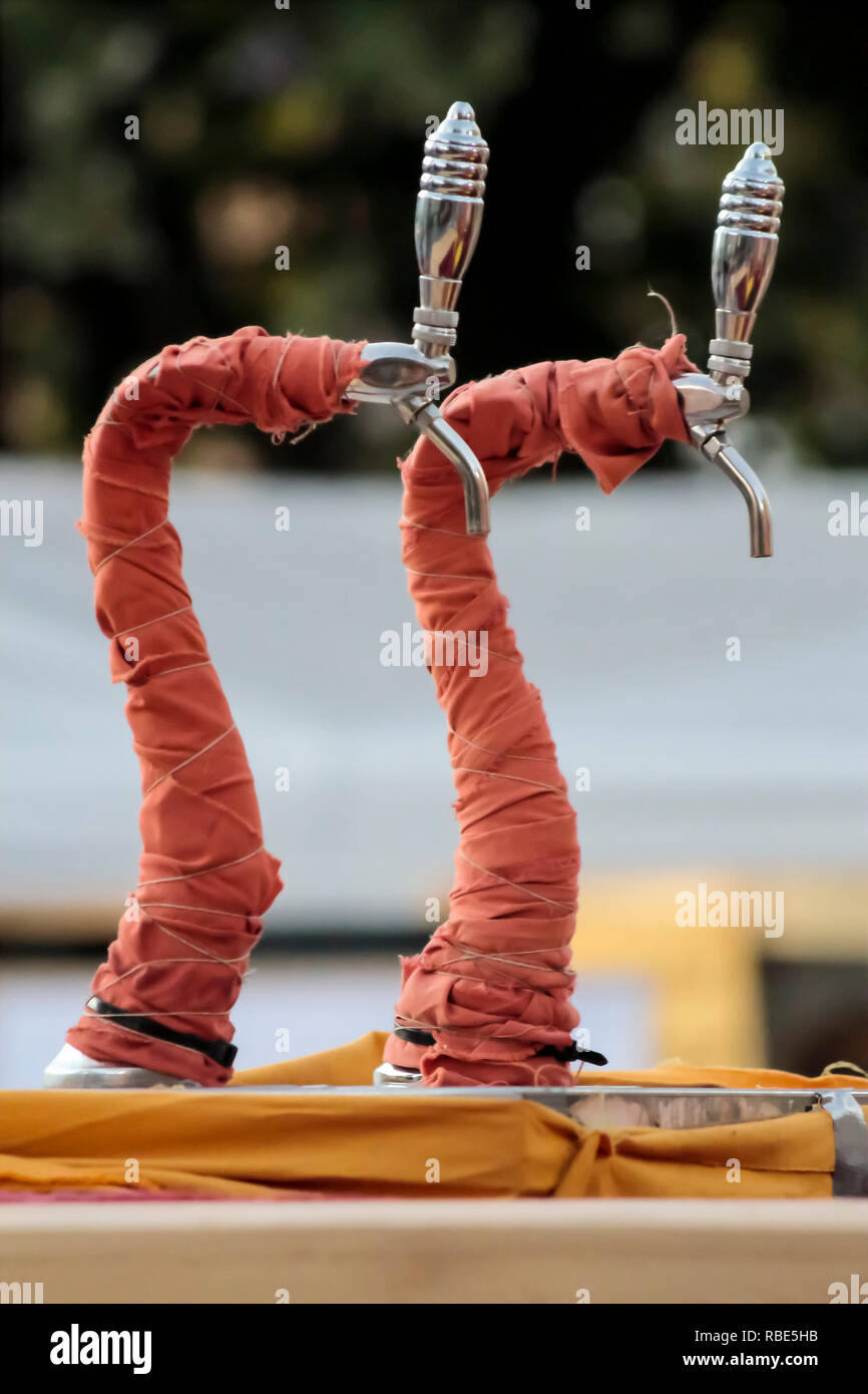 vertical view of two beer taps of an outdoor bar Stock Photo - Alamy