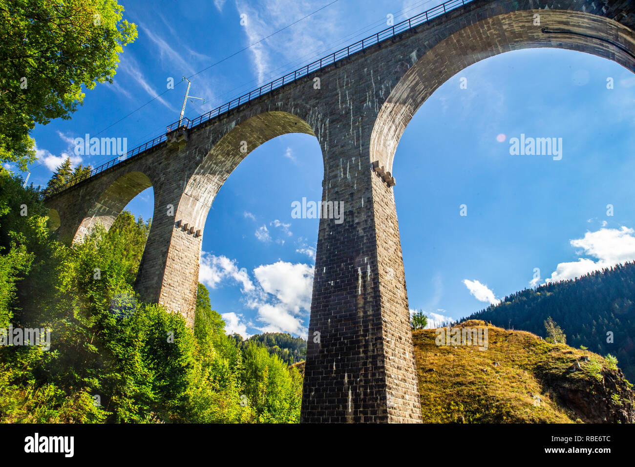Arched railroad train overpass through the Black Forest in Germany ...