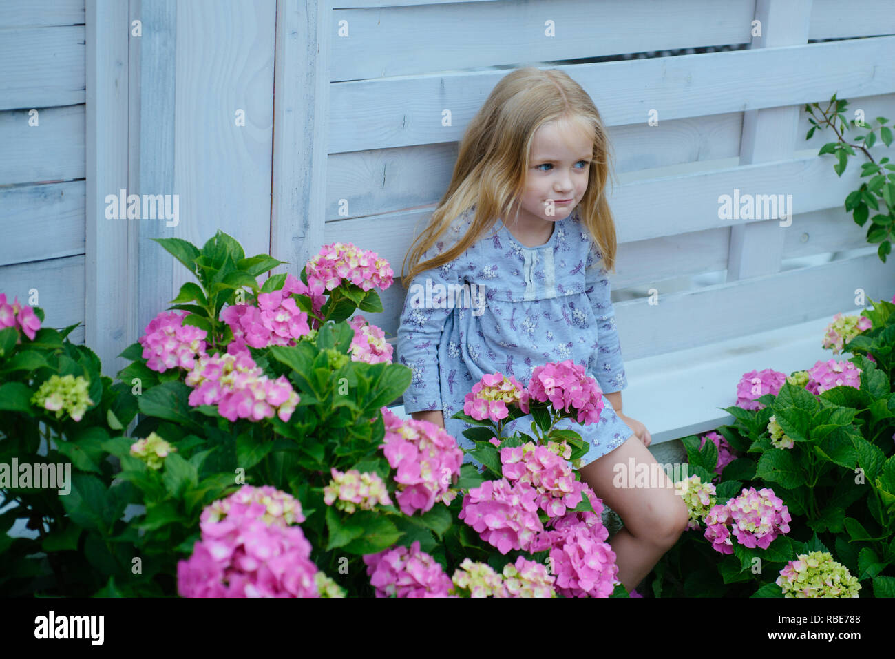 Spring flowers. Childhood. Childrens day. Small baby girl. New life ...