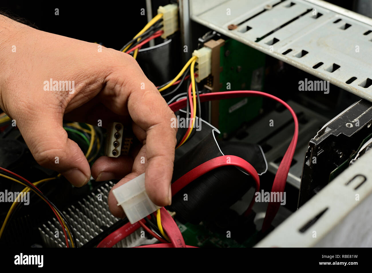 Engineer is repairing electrical wire in a modern electrical equipment ...
