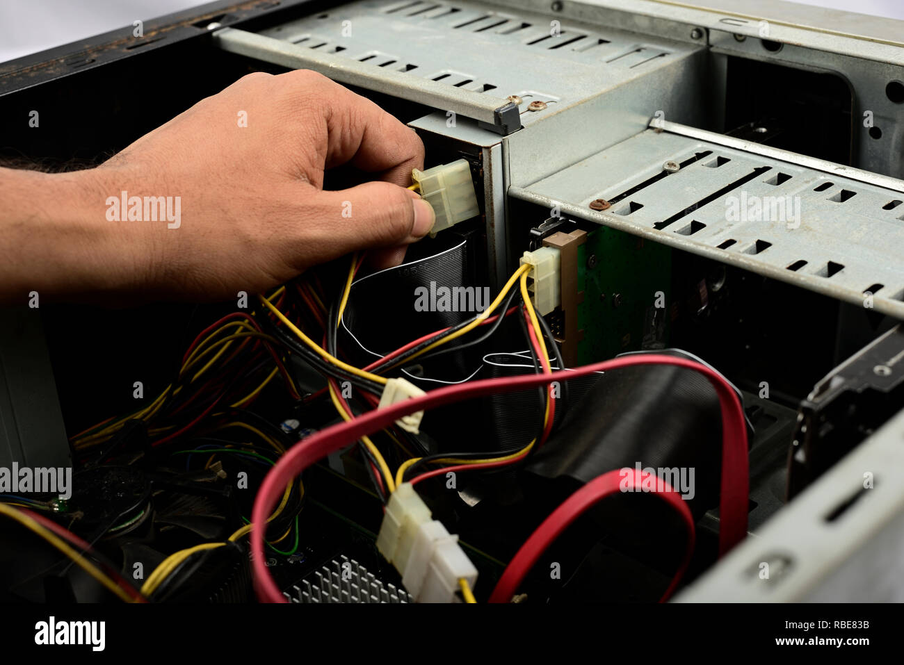 Engineer is repairing electrical wire in a modern electrical equipment ...