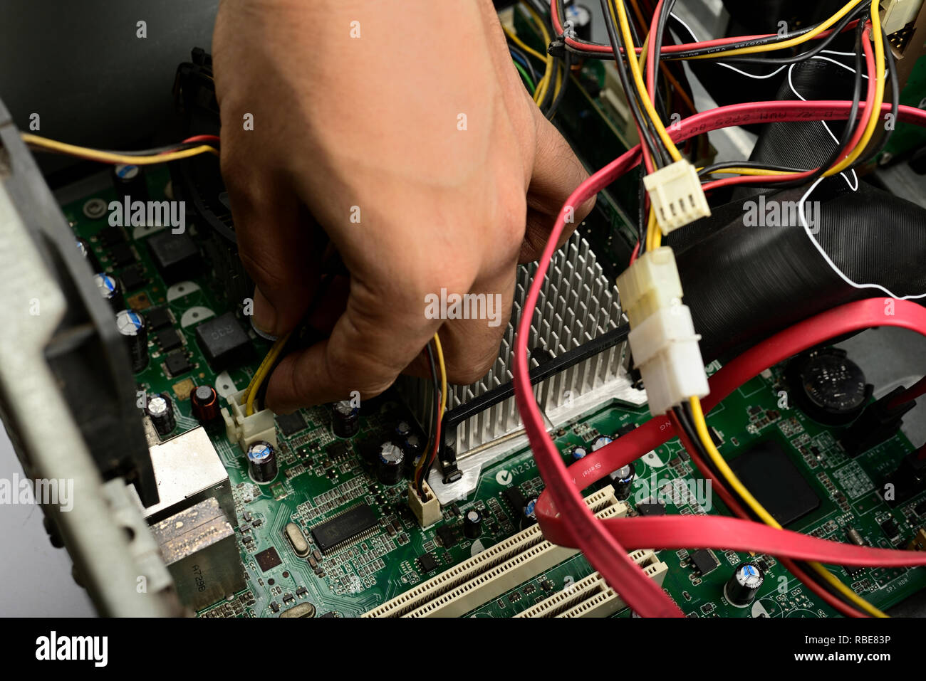 Engineer is repairing electrical wire in a modern electrical equipment ...
