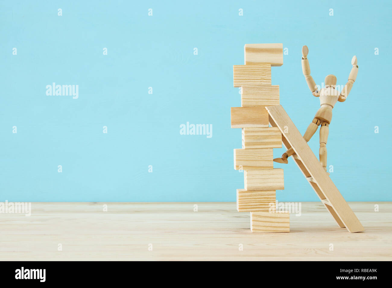 wooden dummy climbs a dangerously unstable structure and risks falling ...
