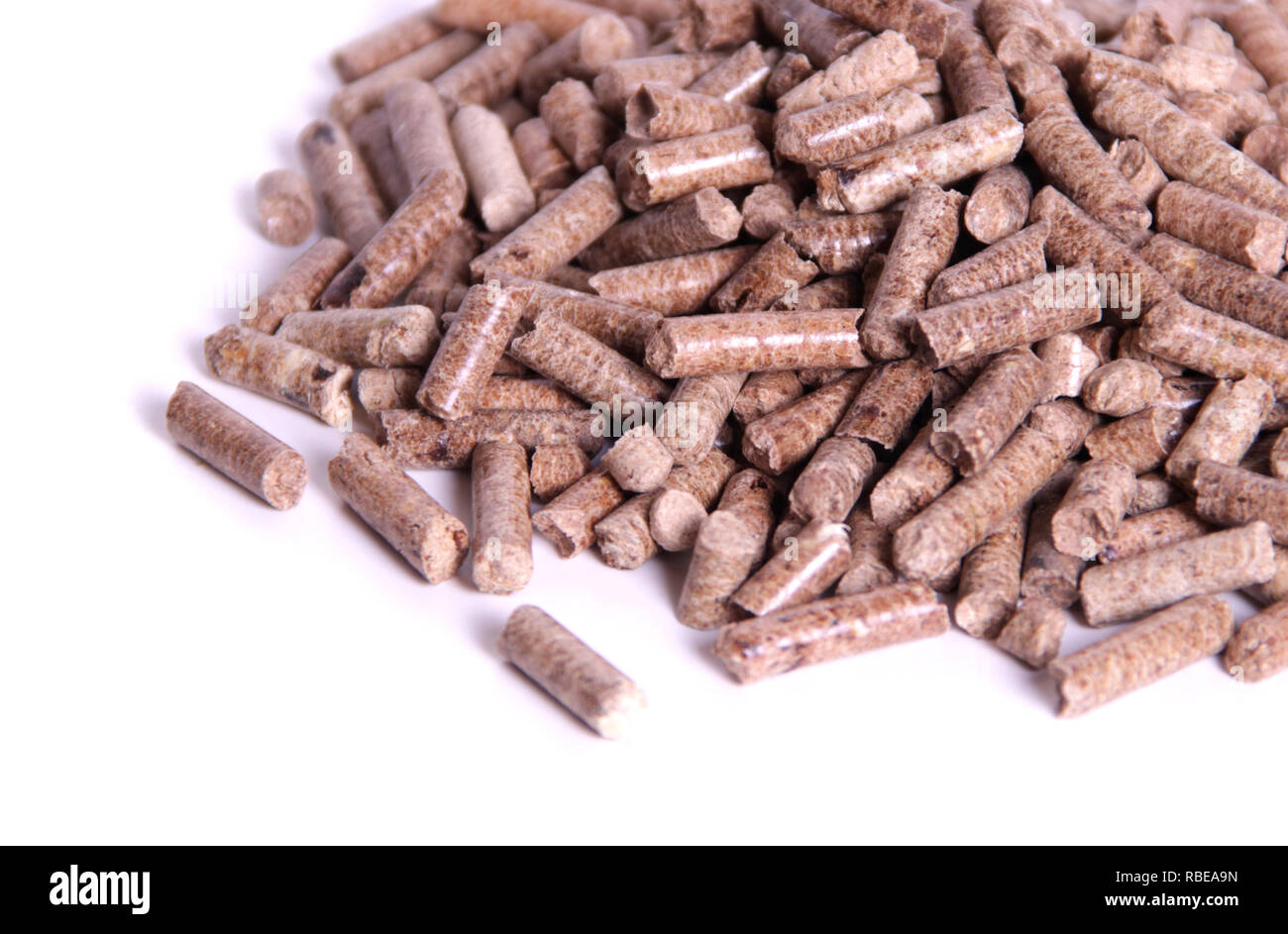 Wooden pellet isolated on white Stock Photo - Alamy