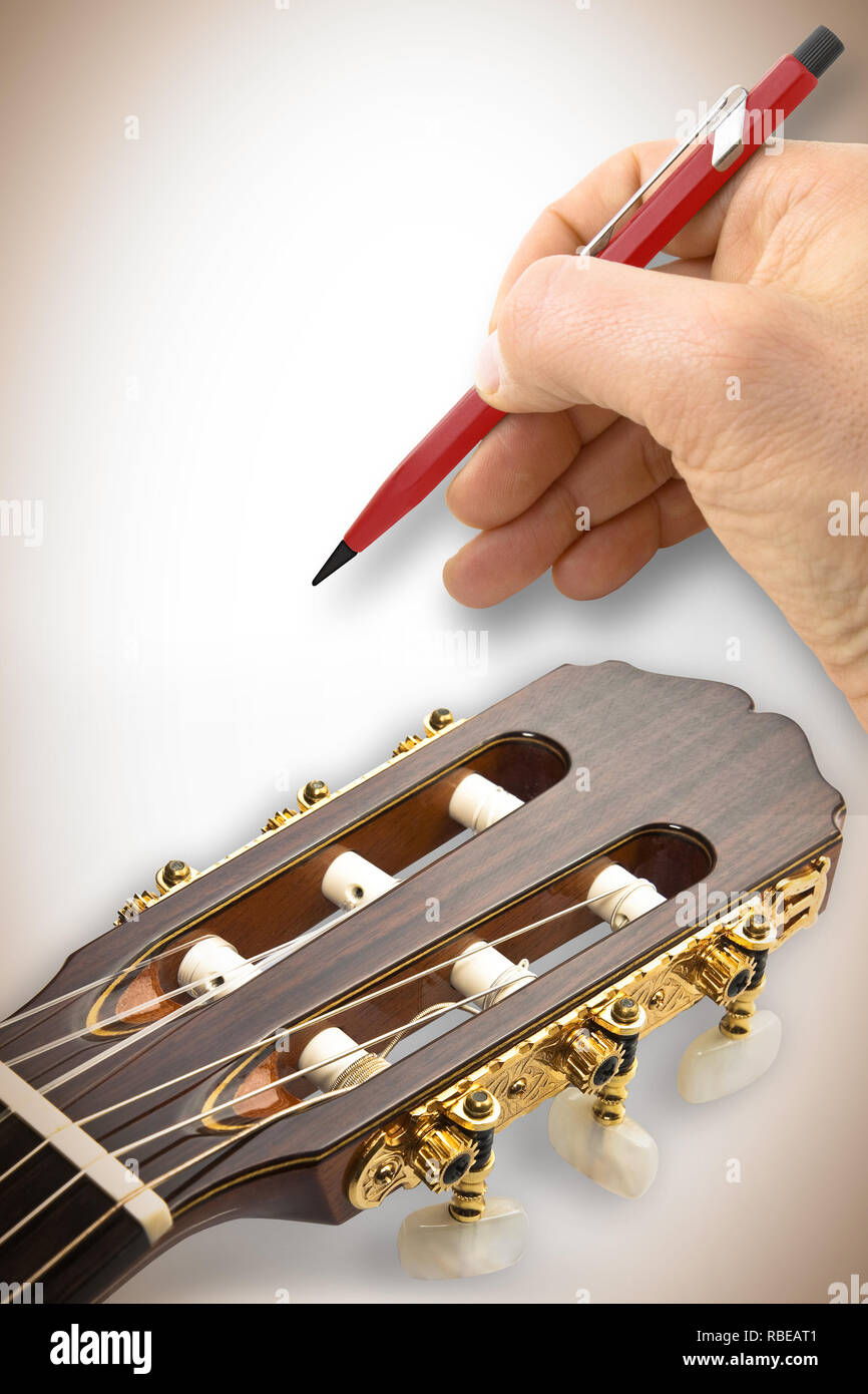 Hand writing above a background with acoustic classical guitar Stock ...