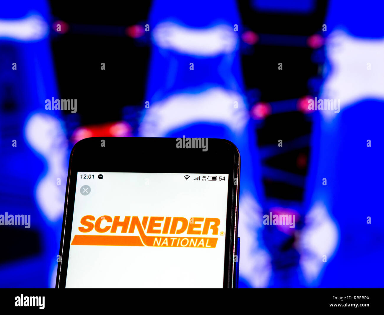 Schneider National Logistics company logo seen displayed on smart phone ...