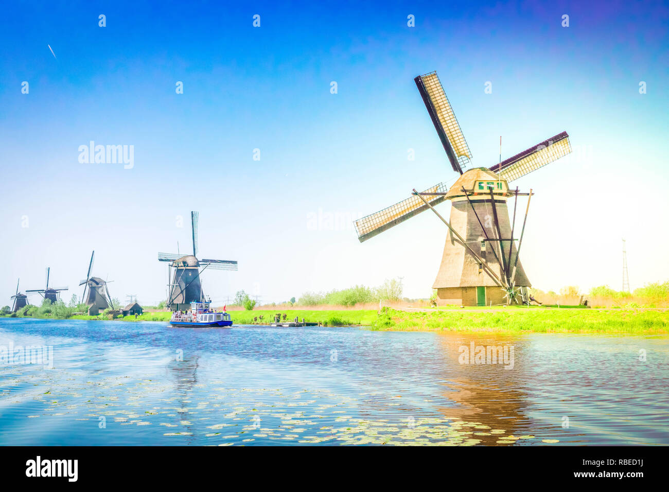 traditional dutch windmills row in Kinderdijk at summer day, Netherland ...