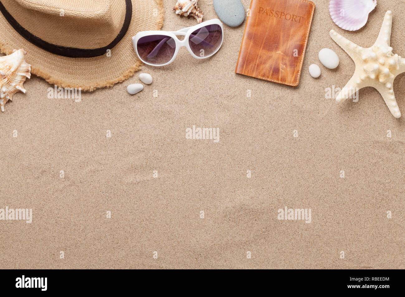 Travel vacation background concept with sunglasses and hat on sand ...