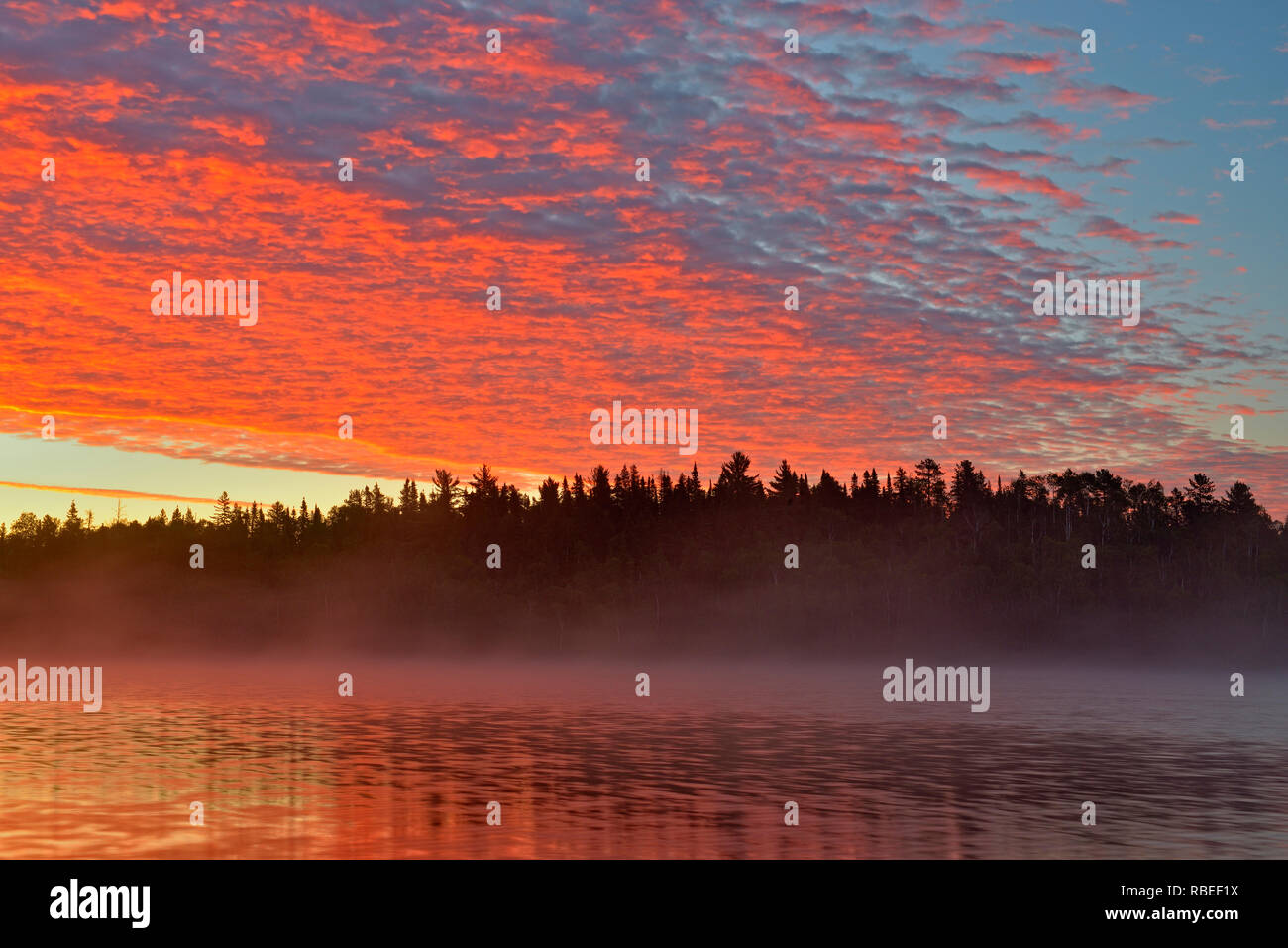 Sunrise sky reflected in Halfway Lake, Halfway Lake Provincial Park ...