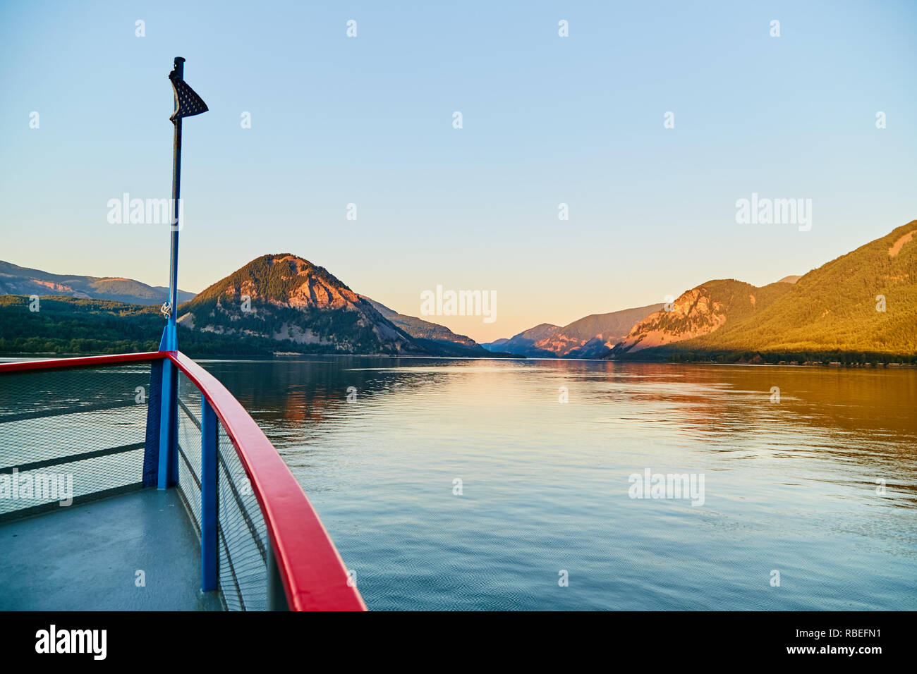 boat at sunset on river facing forward Stock Photo - Alamy